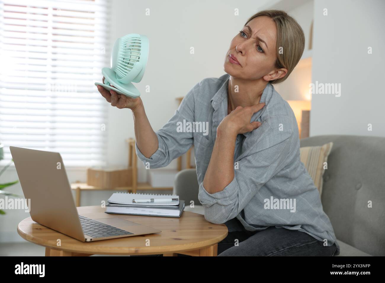 Too hot woman sweating fan hi-res stock photography and images - Alamy