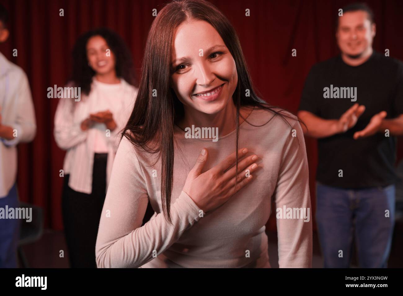 Professional actors bowing on stage in theatre Stock Photo - Alamy