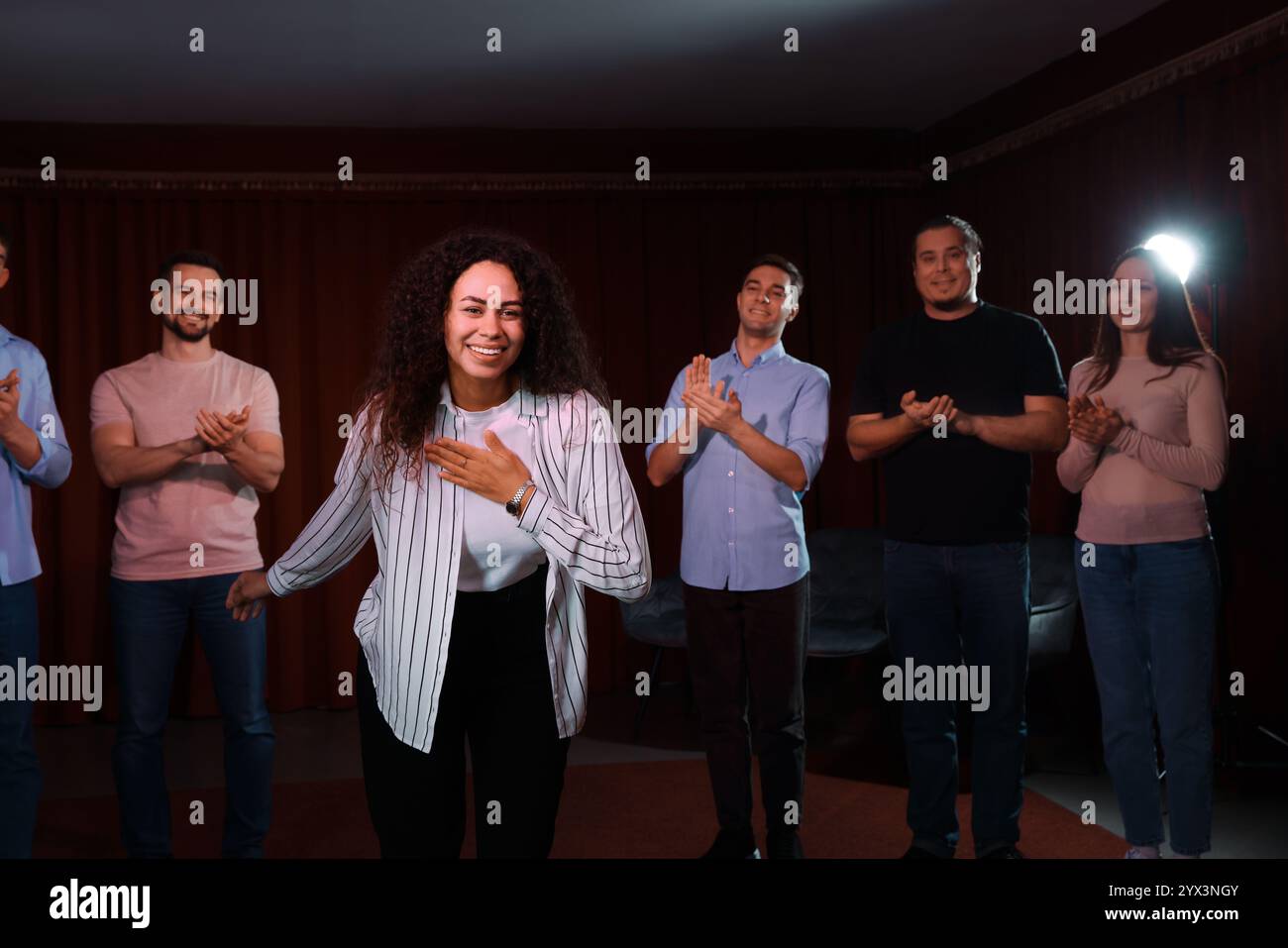 Professional actors bowing on stage in theatre Stock Photo - Alamy
