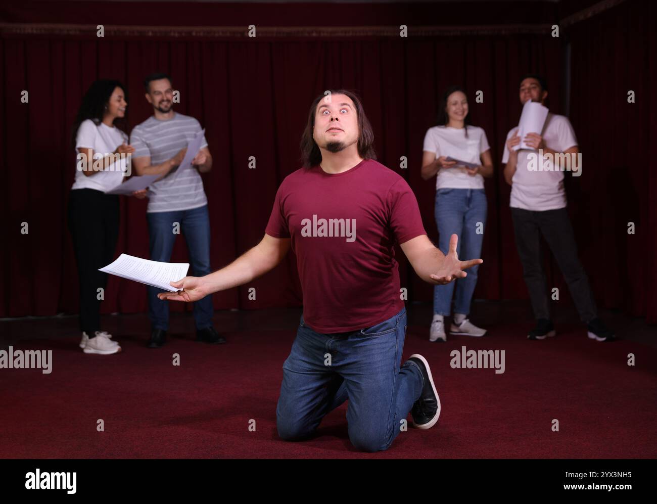 Professional actors with their scripts rehearsing in theatre Stock ...