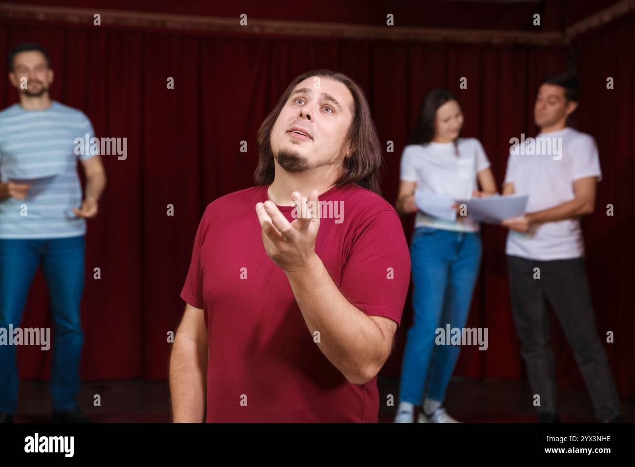 Professional actor rehearsing on stage in theatre Stock Photo - Alamy
