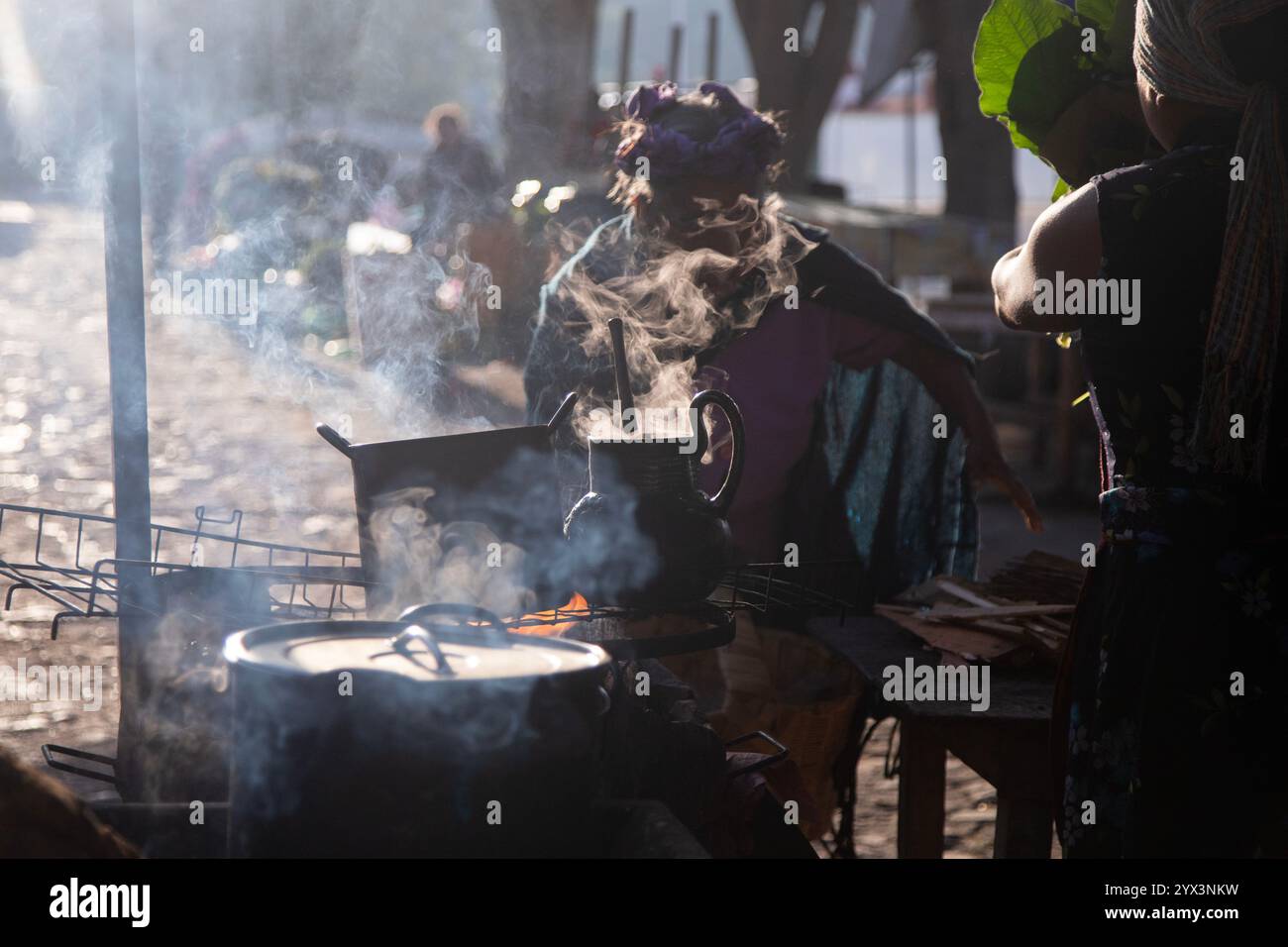 Clay and iron pots at a street food stand in Oaxaca cooking traditional ...