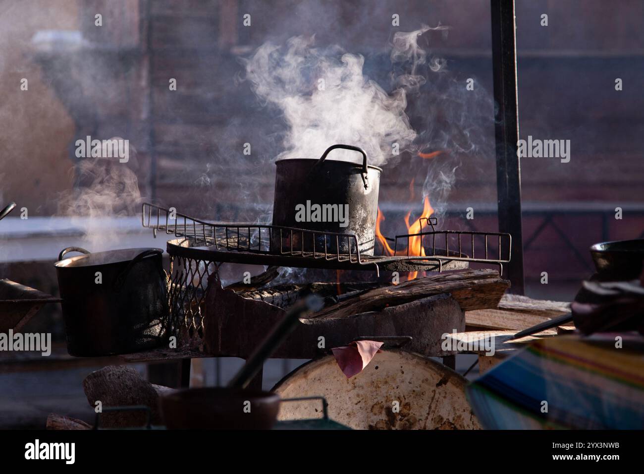Clay and iron pots at a street food stand in Oaxaca cooking traditional ...