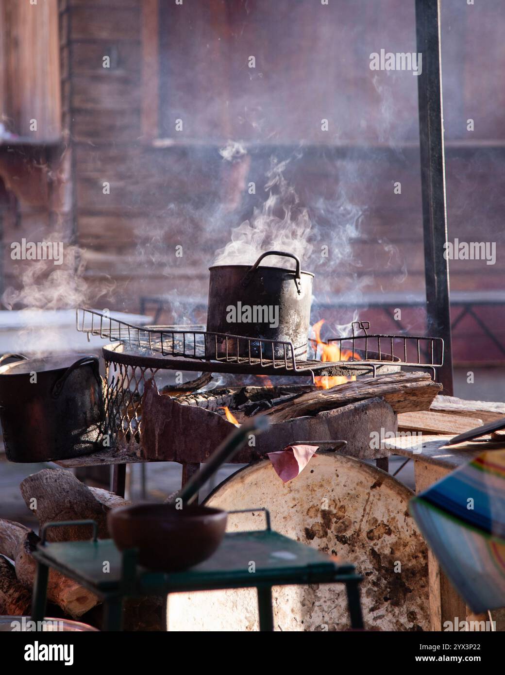 Clay and iron pots at a street food stand in Oaxaca cooking traditional ...