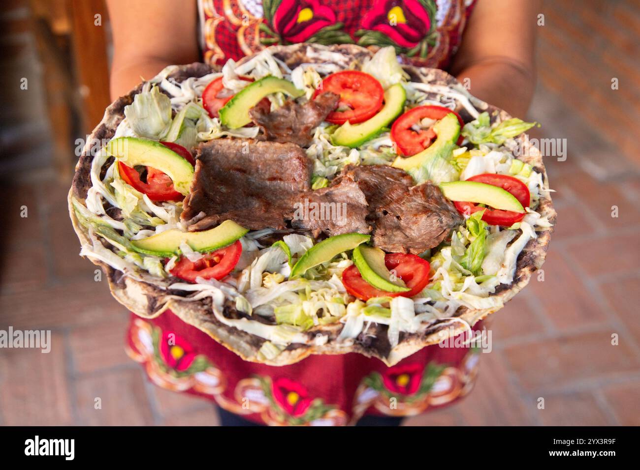 Tlayuda is a thin, crispy tortilla topped with black beans, beef jerky ...