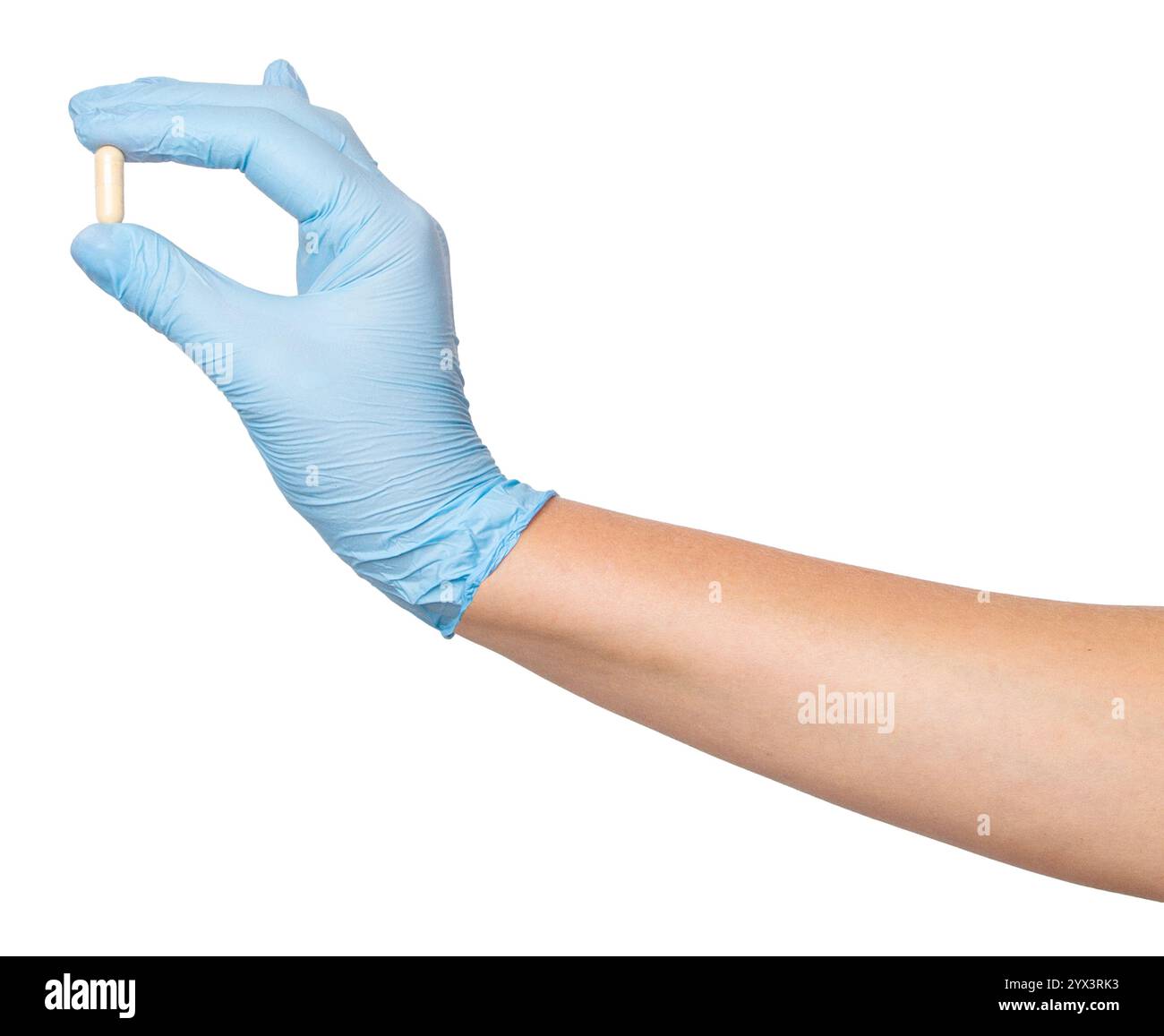 Hand in medical gloves holding a capsule on an empty background ...