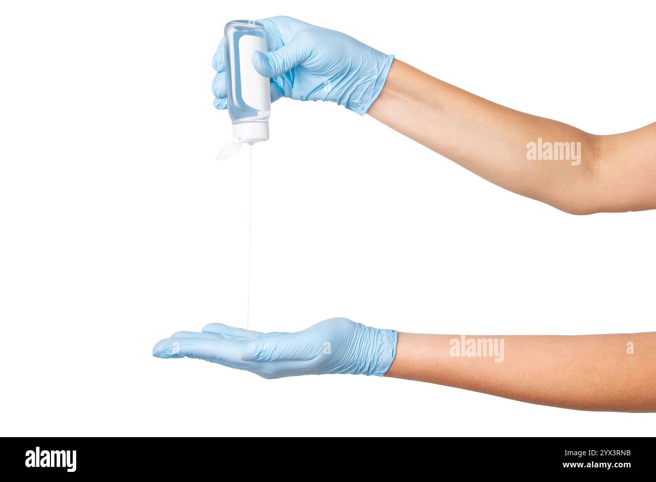 Two hands in medical gloves, one pouring antiseptic on the other, on an ...
