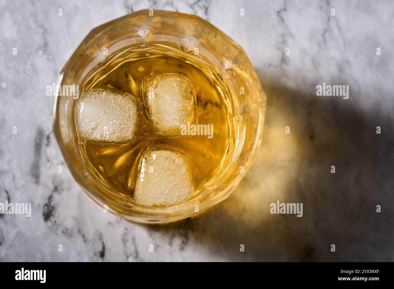 Closeup of a glass of whisky with ice on a marble background Stock ...