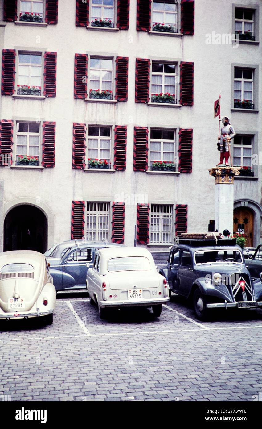 Cars parked next to Renaissance fountain statue of Vennerbrunnen, city ...