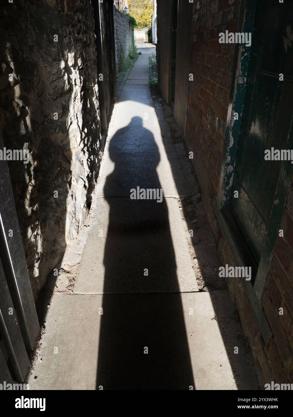 My shadow in a narrow, claustrophobic alley by the Unicorn Theatre ...