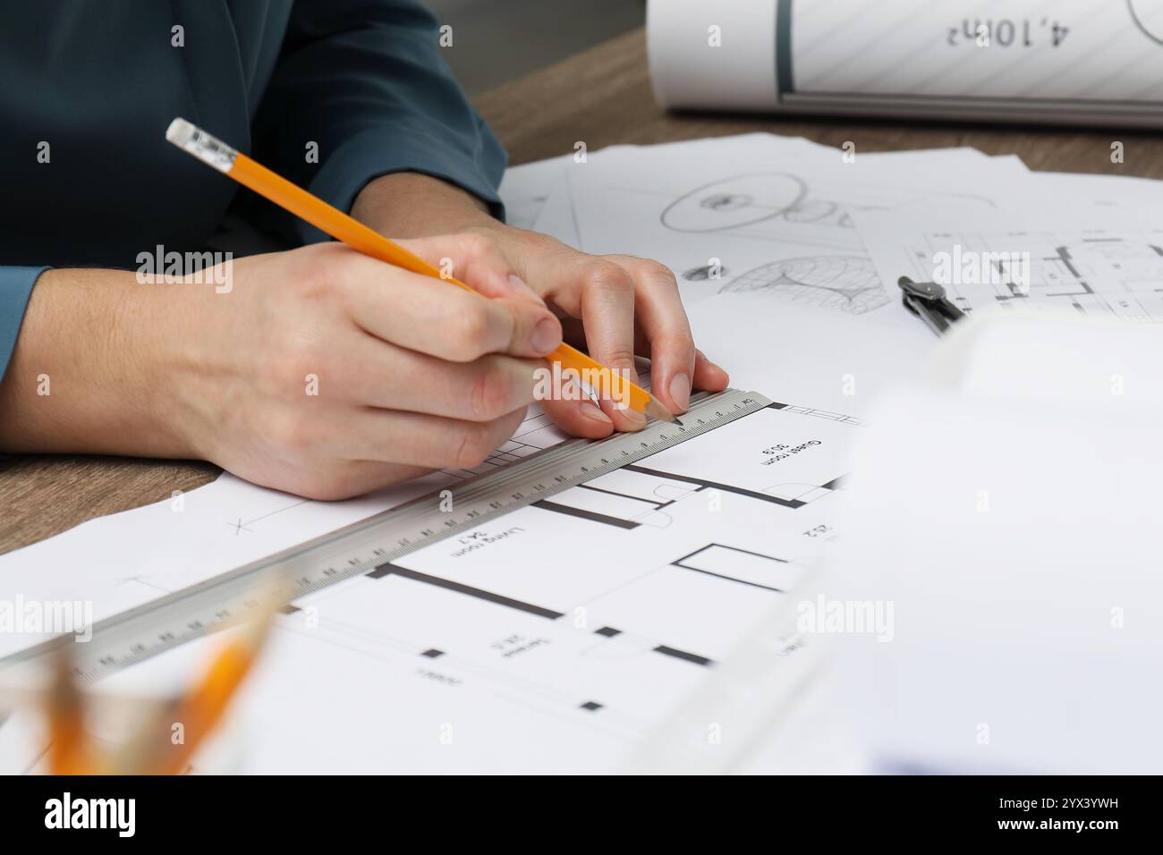 Architect working with project, closeup. Different technical drawings on table Stock Photo - Alamy