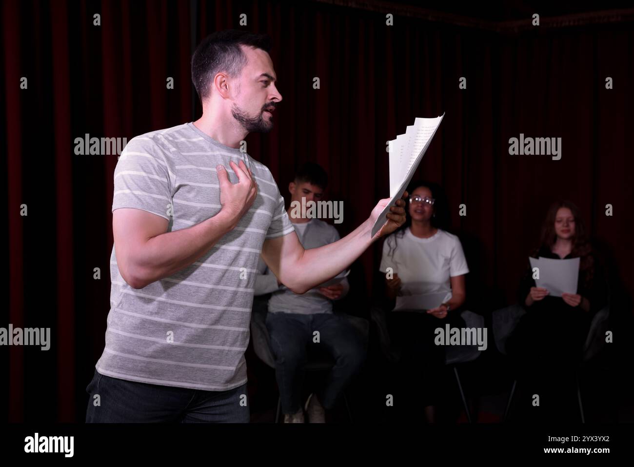 Professional actor rehearsing on stage in theatre Stock Photo - Alamy