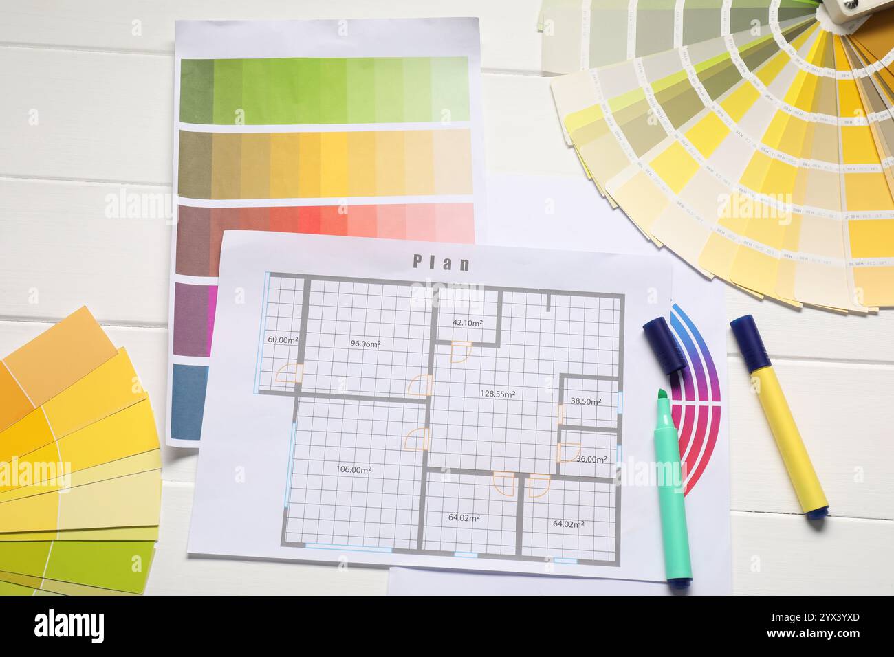 Designer's workplace with color palettes, floor plan and stationery on ...