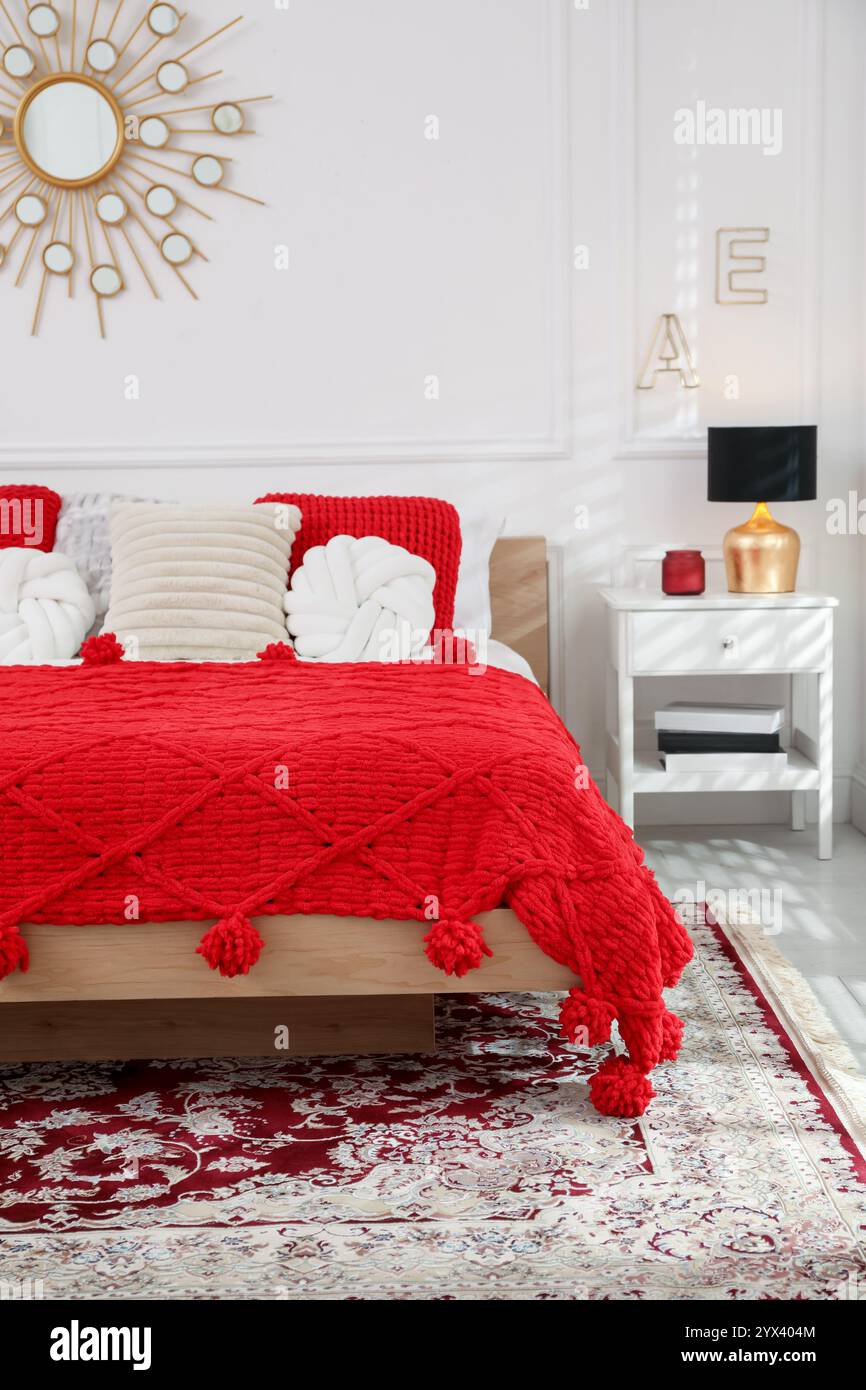 Big comfortable bed in room. Interior design Stock Photo - Alamy