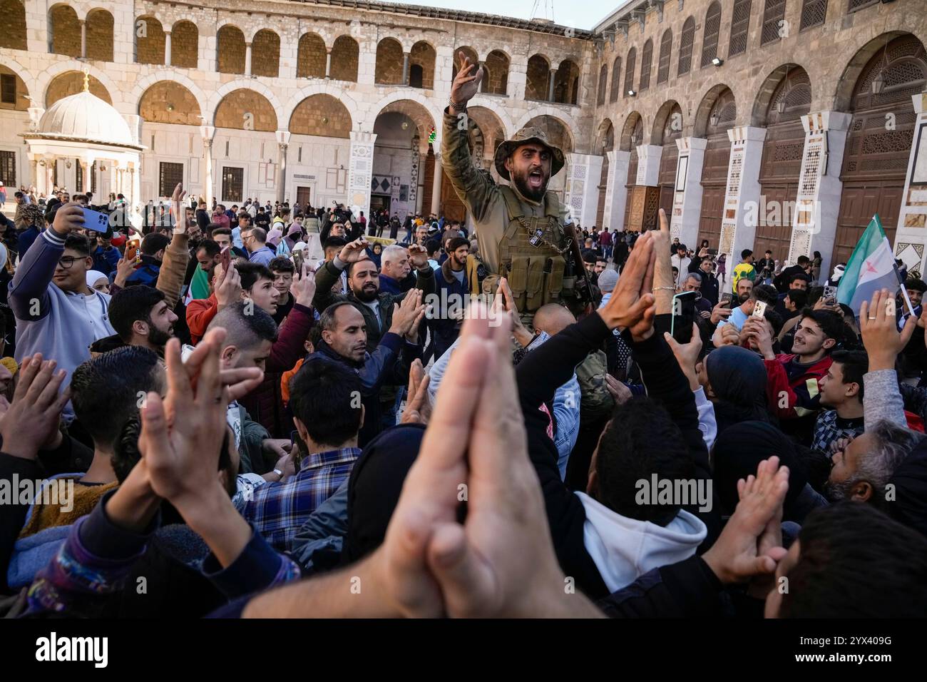 Syrians fighters and civilians chant slogans as they gather before ...