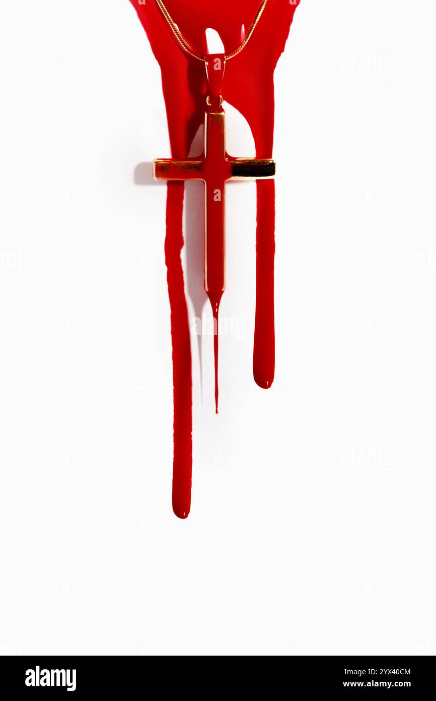 cross in blood with streaks and drops of blood on a light background ...