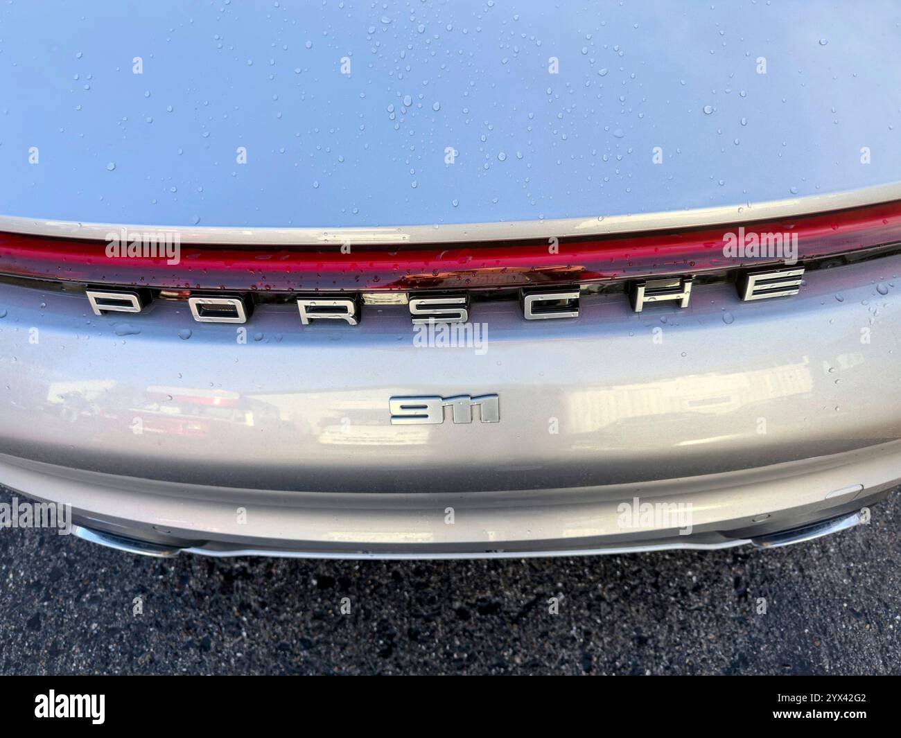 Rear chrome Porsche badge close-up Silver Porsche 911 sports car Stock ...