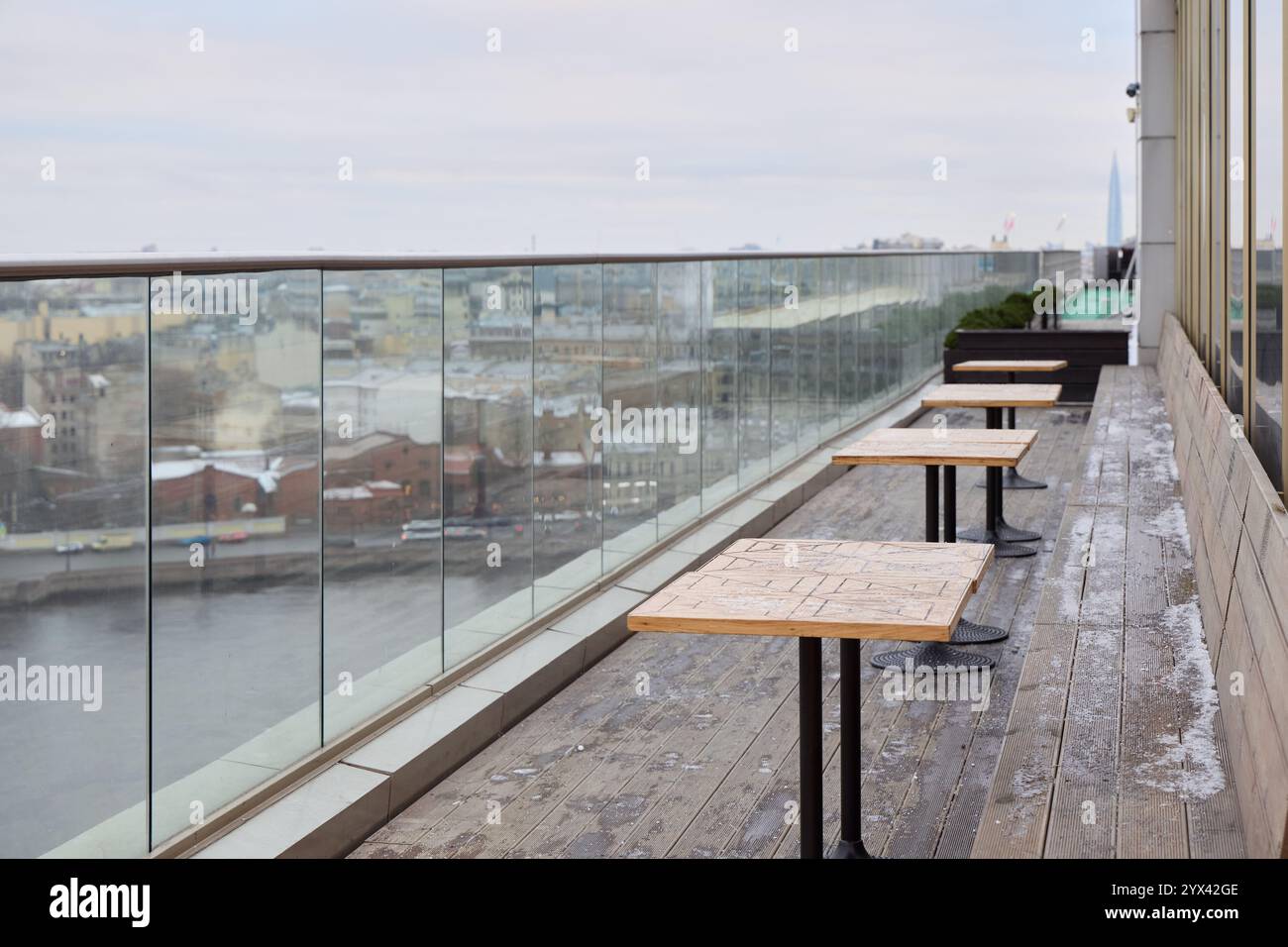 A beautifully designed modern balcony featuring an amazing scenic city ...