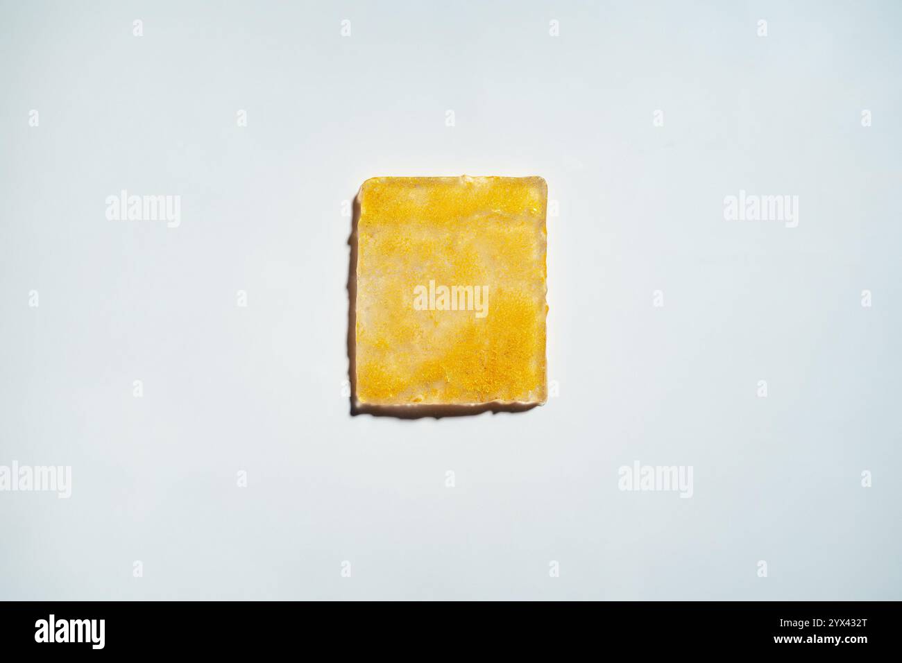 Gold gel rectangle smear on white background Stock Photo - Alamy