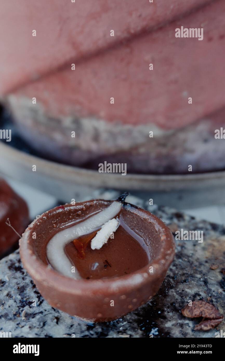 Experience the serene tradition of preparing clay pot lamps with cotton ...