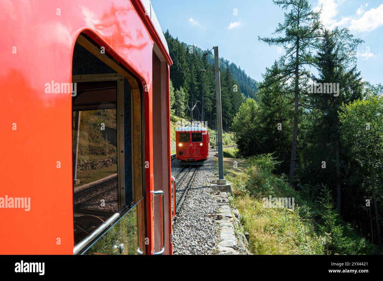 View from the window of red historic train to Mer de Glace glacier in ...