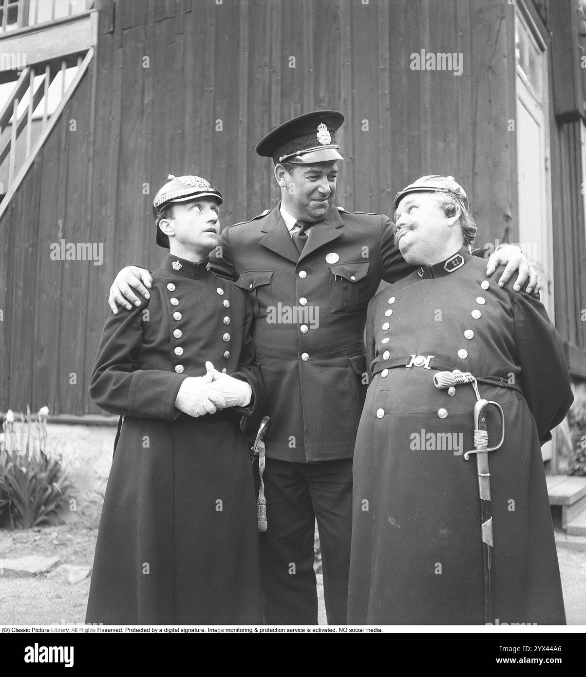 Police officers in 1956. Three men in police uniforms. The policeman in ...