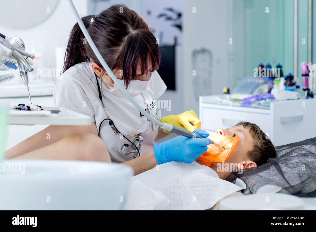 Children's dentistry. First examination at the dentist. A cute handsome ...