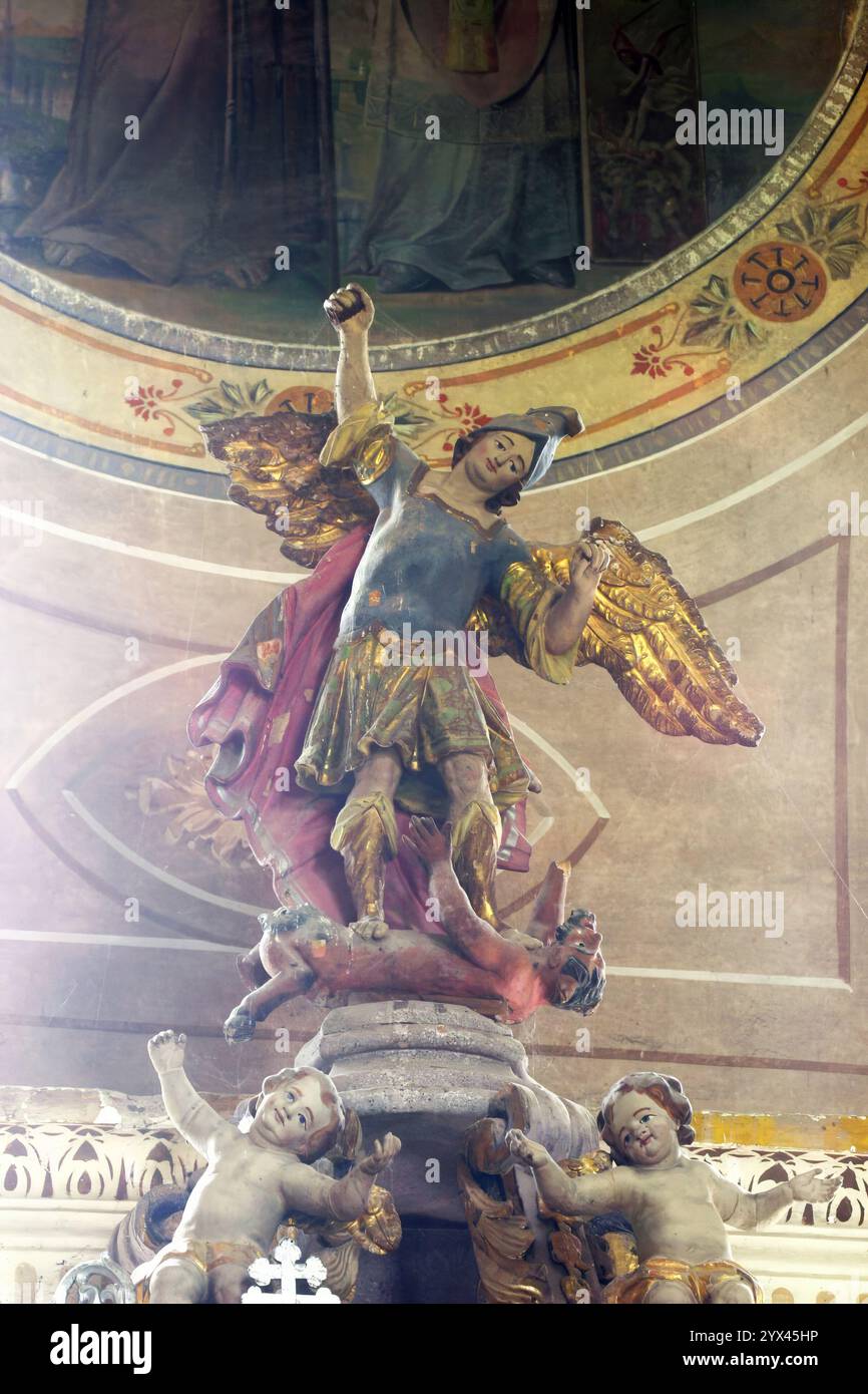 Saint Michael, statue on the pulpit in Church of Saint Michael the Archangel in Ludina Croatia ...