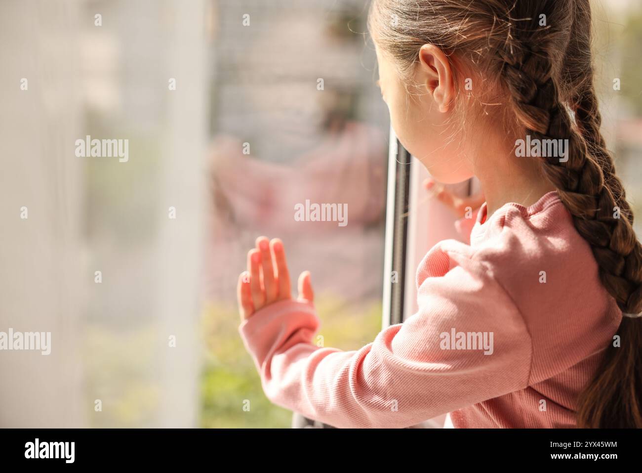 Orphanage concept. Sad girl near window indoors Stock Photo - Alamy