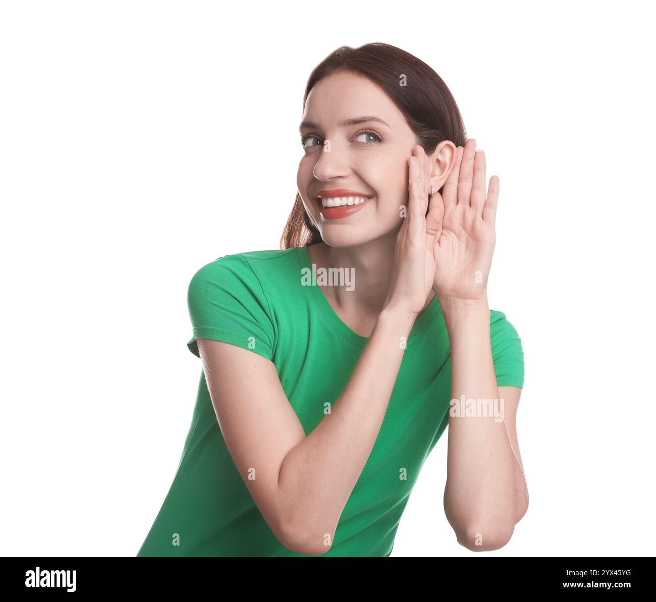 Woman showing hand to ear gesture on white background Stock Photo - Alamy