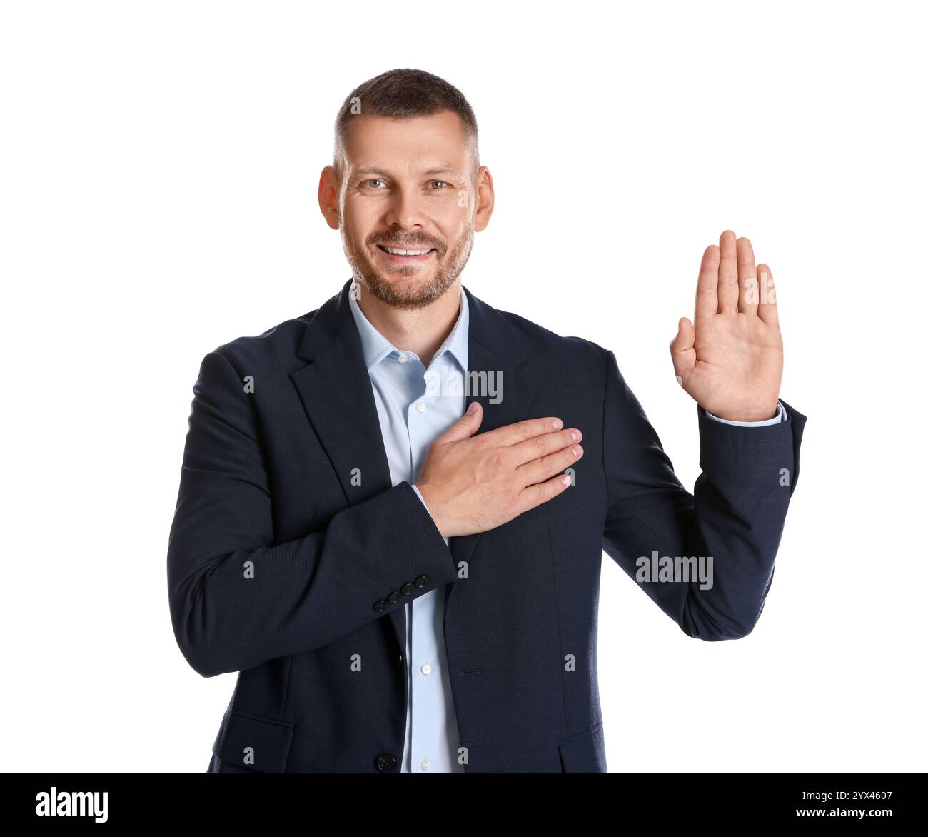 Man making promise with raised hand on white background. Oath gesture ...