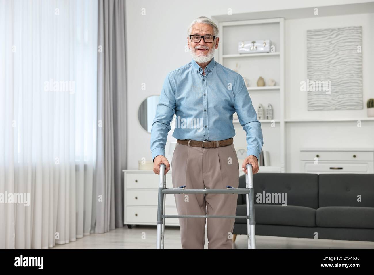 Using walking frame using walking aid hi-res stock photography and ...