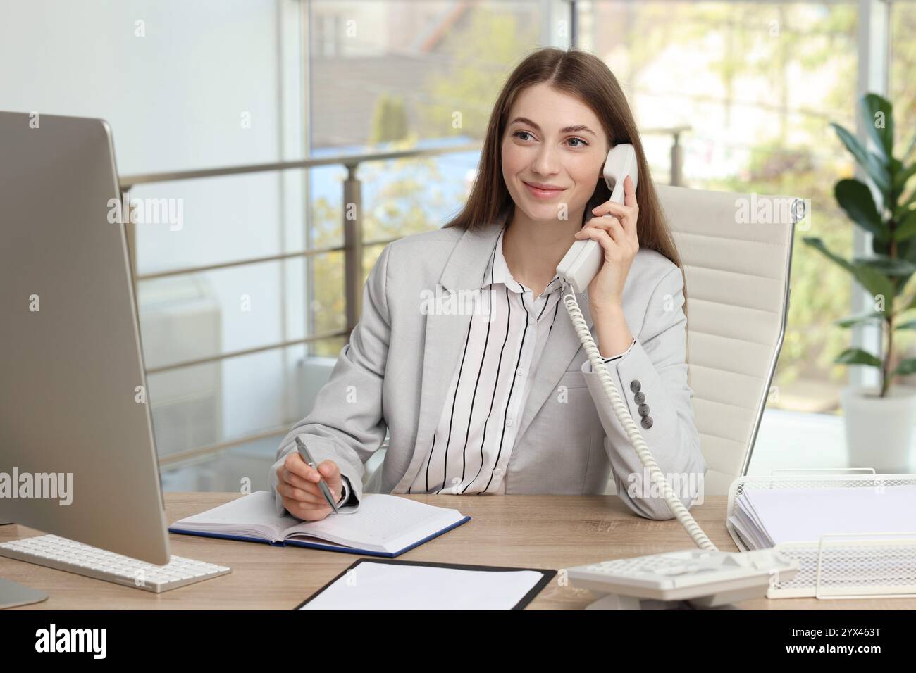 Money manager on telephone hi-res stock photography and images - Alamy