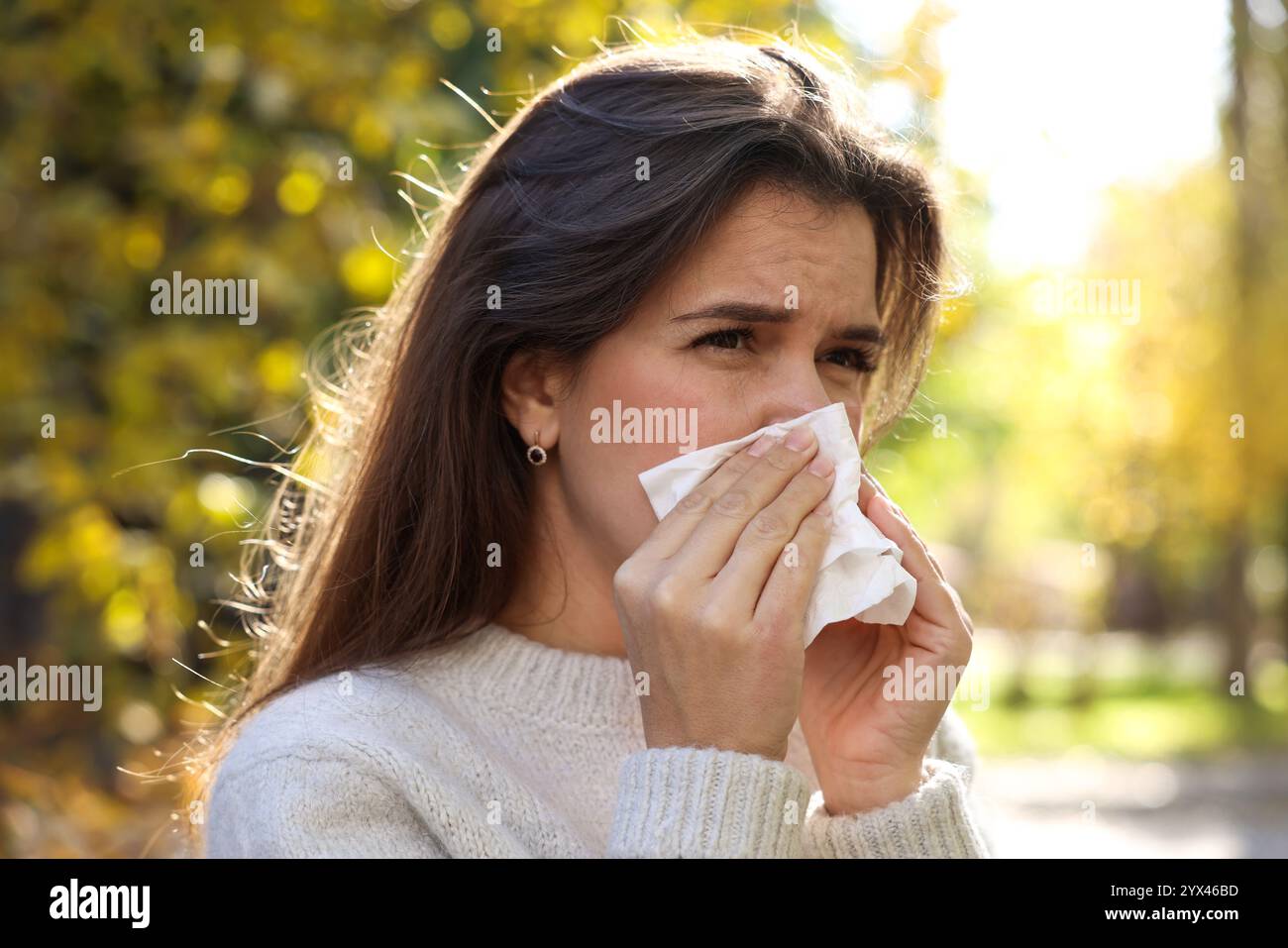Woman autumn park sneezing hi-res stock photography and images - Alamy
