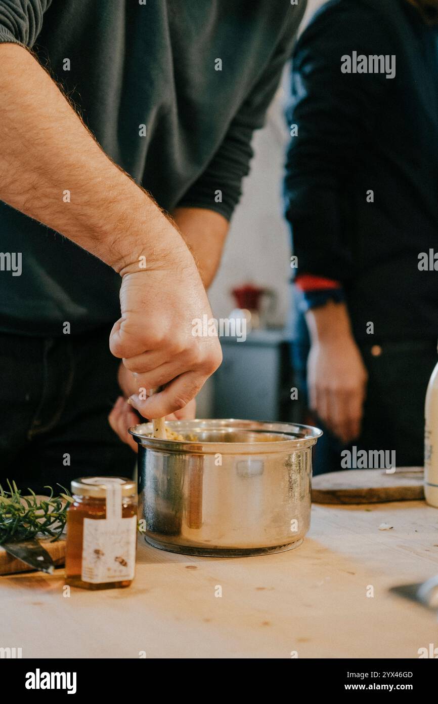 Hands chef stirring spoon vegetable hi-res stock photography and images ...