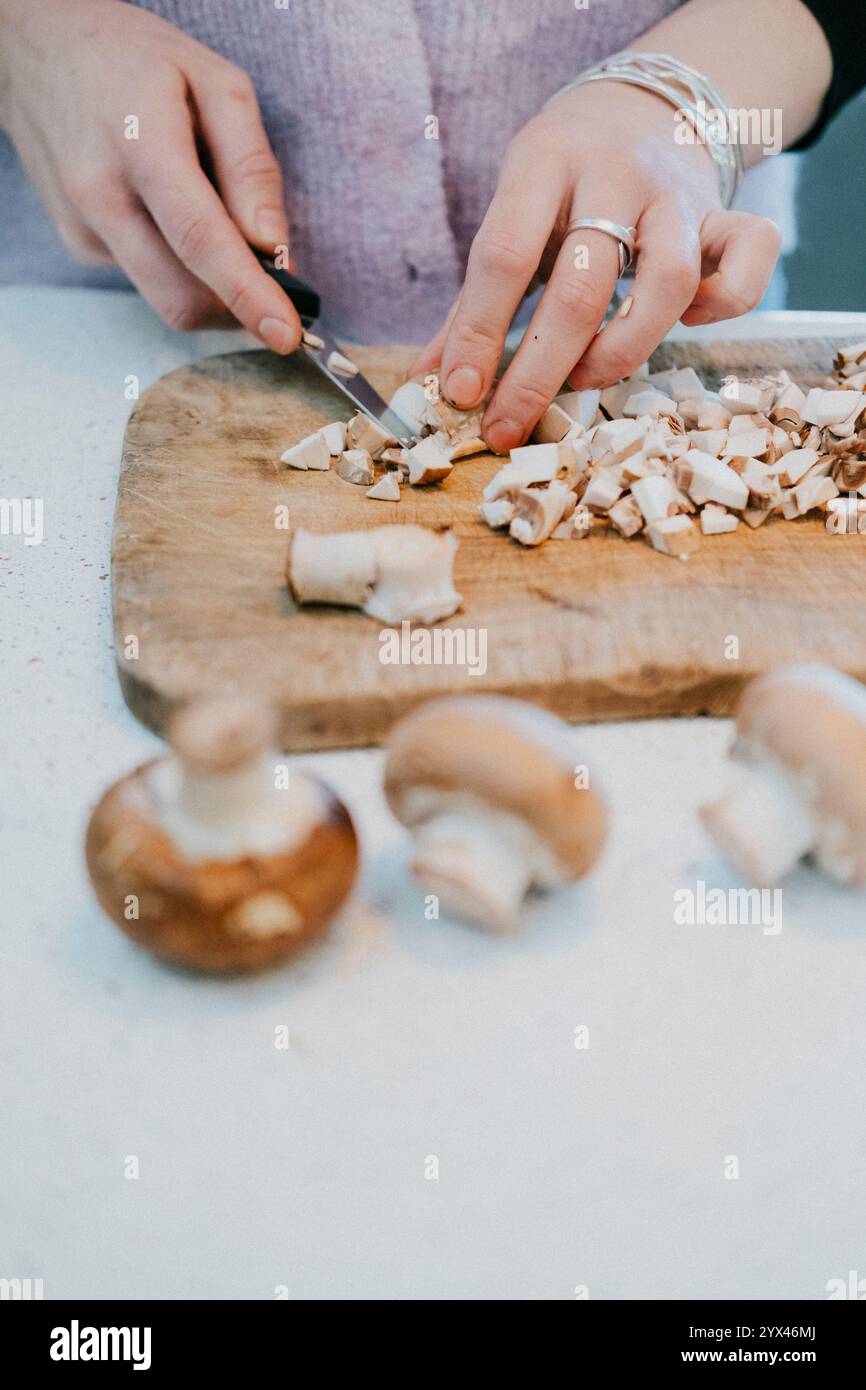 Chef woman cutting fresh champignon hi-res stock photography and images ...