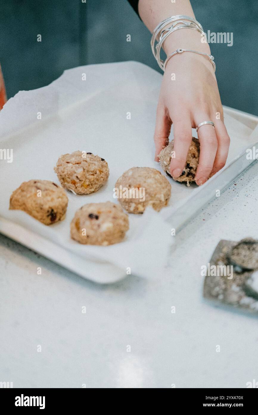 Woman making cookies using recipe hi-res stock photography and images ...