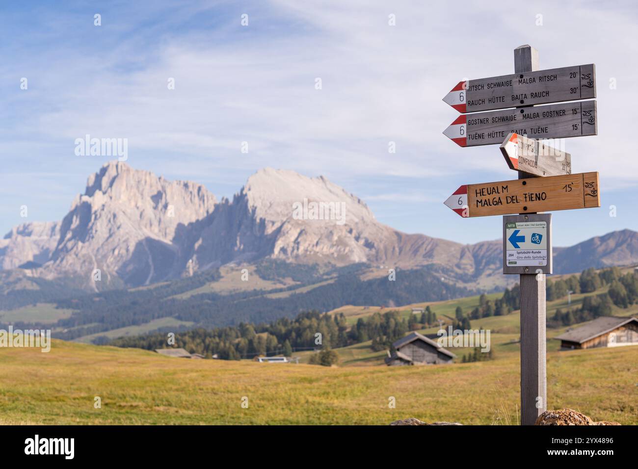 Trail sign post in Seiser Alm plateau and the largest high-elevation ...