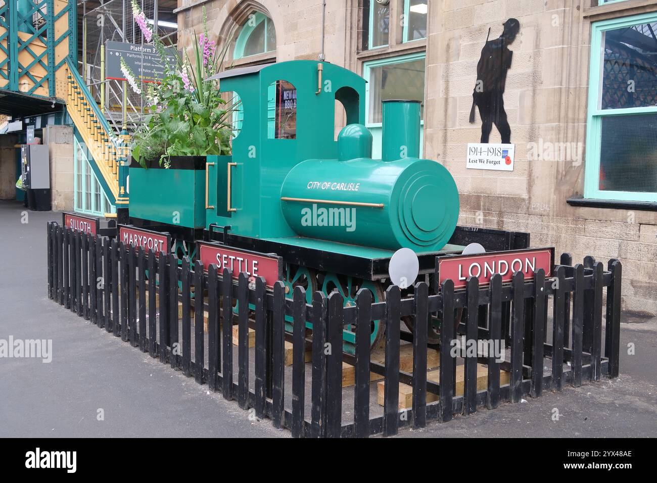 A model steam locomotive "City of Carlisle" with floral display, on the ...