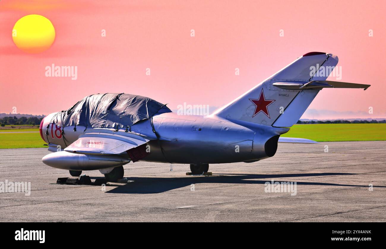 Russian MIG--15 fighter trainer in Russian colours at sunset in Duxford ...