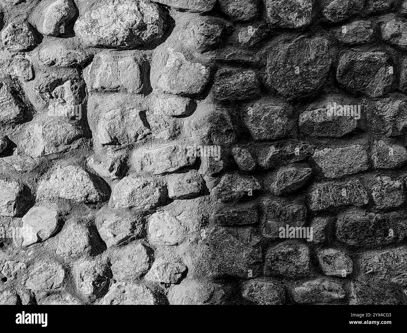 Duality of Light and Shadow on Stone Wall Exterior Stock Photo - Alamy