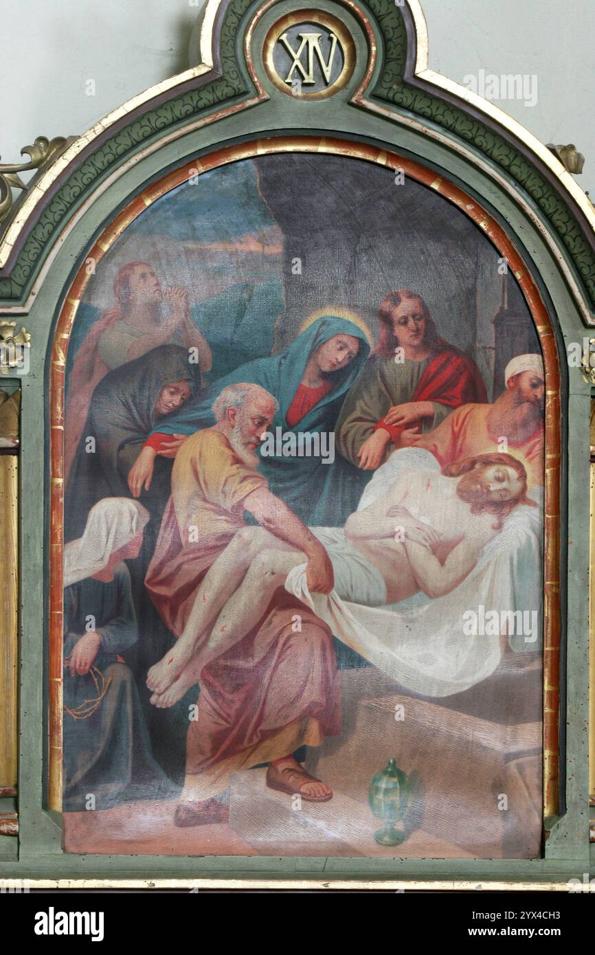 14th Stations of the Cross, Jesus is laid in the tomb and covered in ...