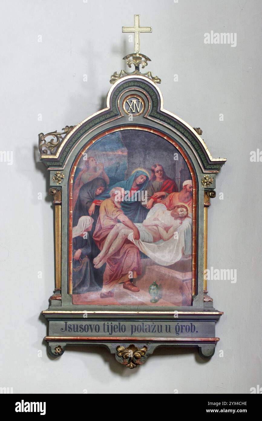 14th Stations of the Cross, Jesus is laid in the tomb and covered in ...