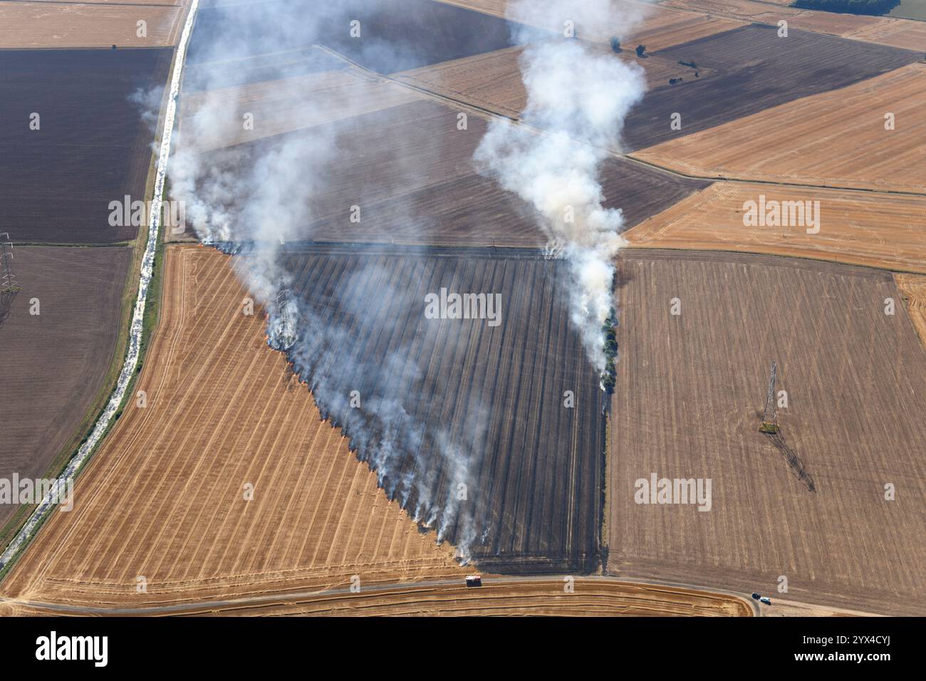 Fires in an arable field engulfing an electricty pylon, Amcotts, North ...