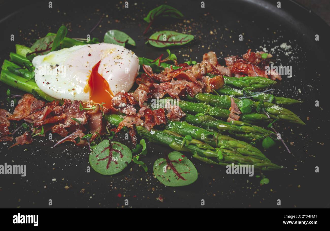 Asparagus with poached egg and fried bacon, micro greens and spices ...