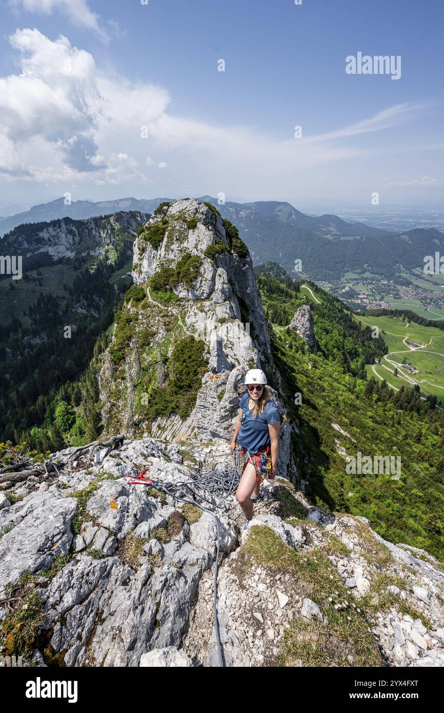 Climber with climbing rope on a climbing tour, climber on a mountain ...