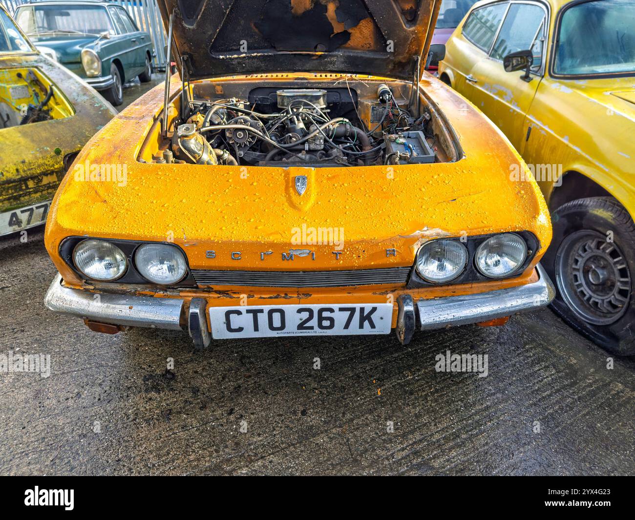 Front view of a yellow classic 1972 Reliant Scimitar sports car with ...