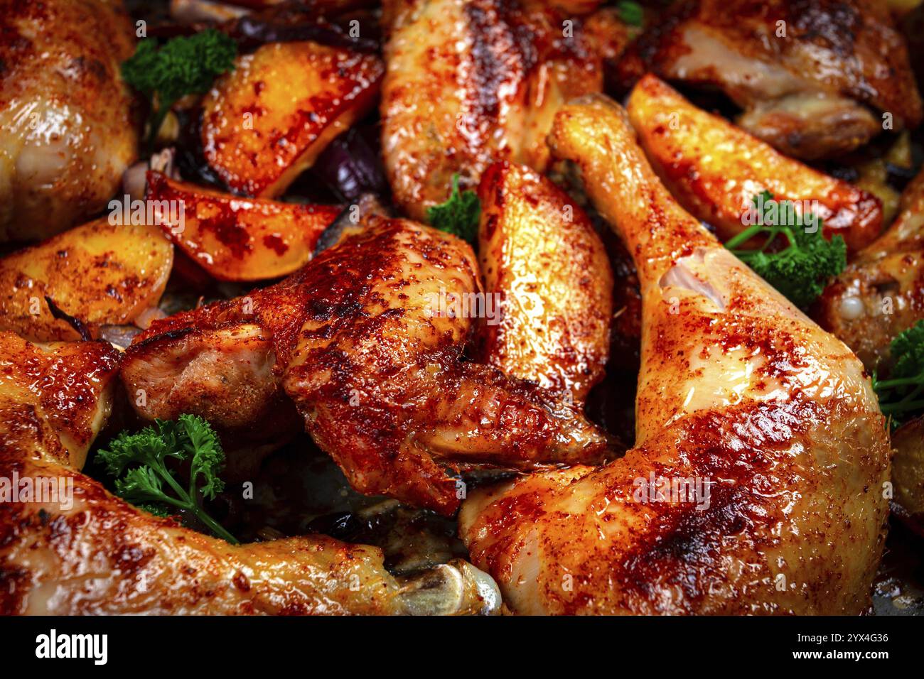 Roast chicken legs with potatoes and onions in the oven, homemade. No ...