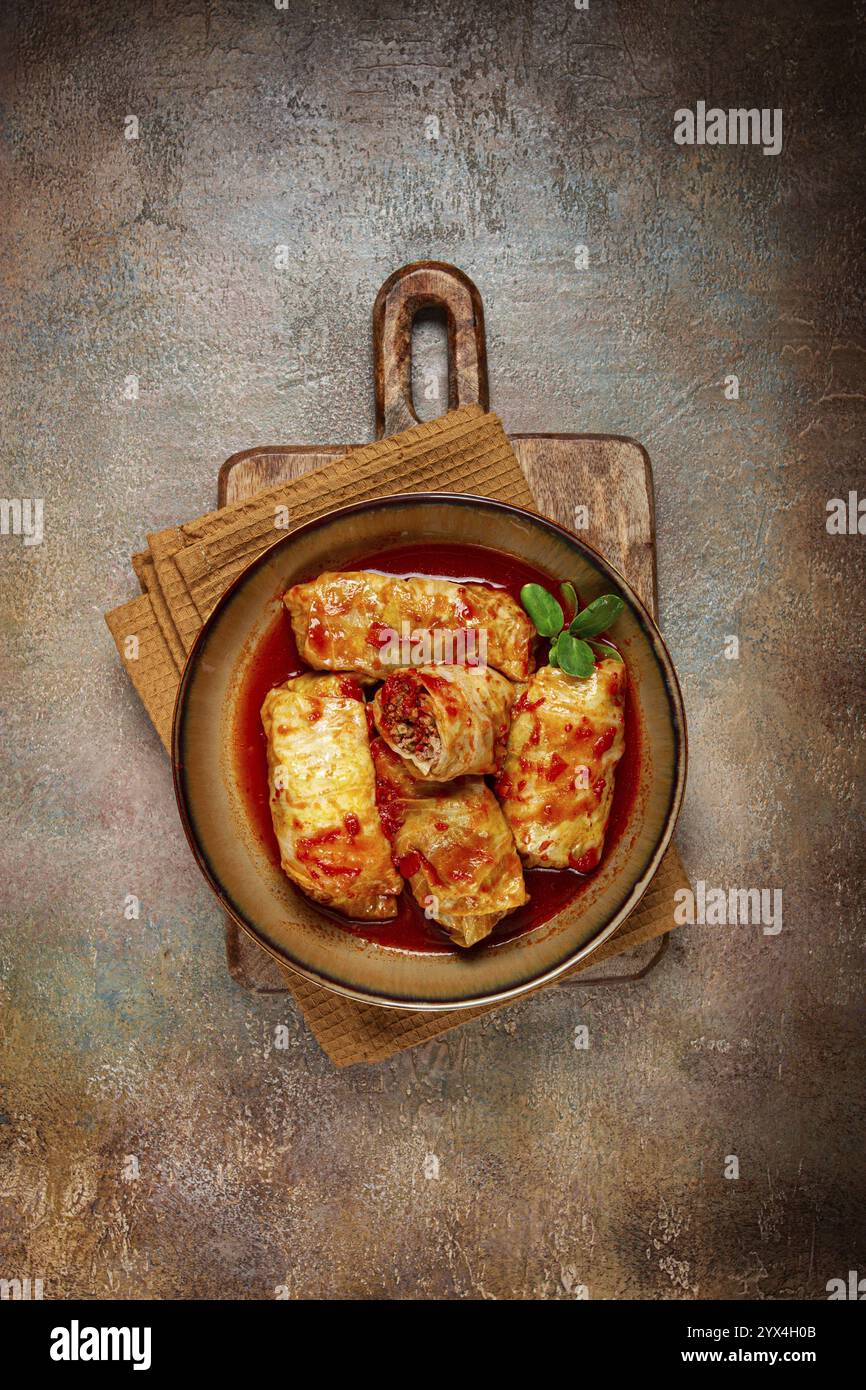 Stuffed cabbage rolls with minced meat, in tomato sauce, top view ...