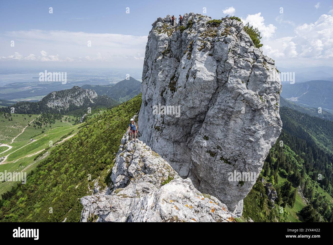 Climber with climbing rope on a climbing tour, climber on a mountain ...